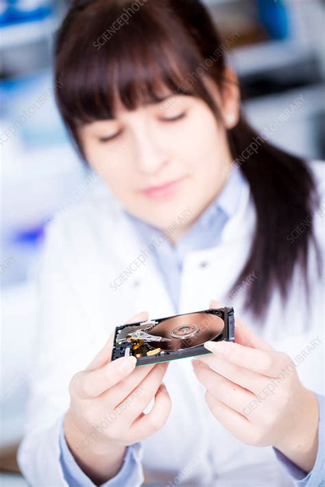 Female Electronics Babe Holding Hard Disc Drive Stock Image F018 3449 Science Photo Library