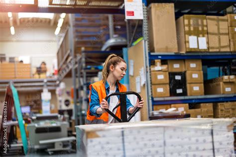 Babe Worker Moving Goods On Pallet Jack At Warehouse Stock Photo Adobe Stock