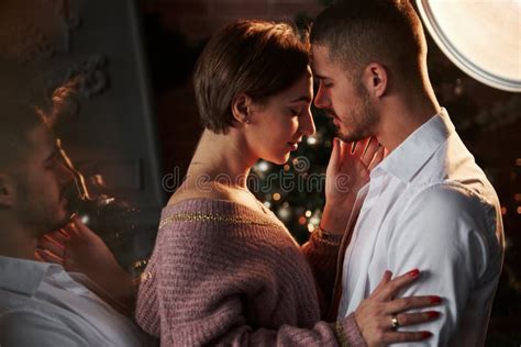 Girl Flirting With A Guy Touching Leg Her Foot Under The Table In A