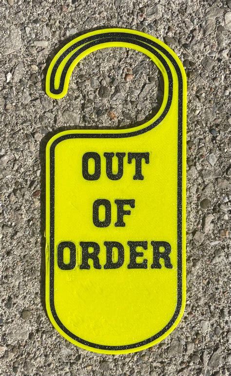 Out Of Order Door Hanger Sign In Vibrant Yellow With Black Lettering