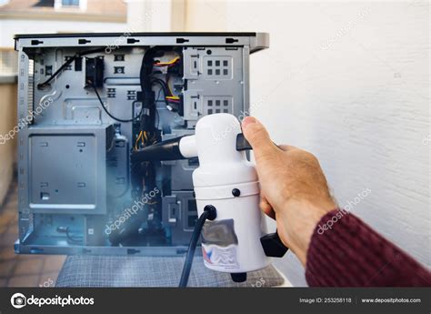 Man Preparing To Clean Computer Case With Dust Cleaner Stock Photo By Ifeelstock