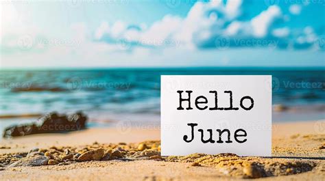 Ai Generated Hello June Message On White Paper On Sandy Beach With Sea