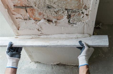 Man Is Putting Gypsum Baseboard With Glue On Ceiling Maintenance Repair Works In The Flat