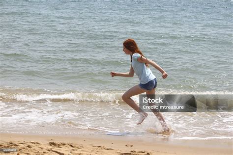 Girl Running Barefoot On Beach By Sea Seaside Exercise Image Stock