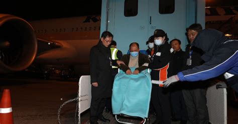 중국 경호원 폭행당한 사진기자 귀국