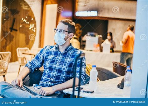 Airport European Nerd Man In Glasses And Plaid Shirt With Luggage