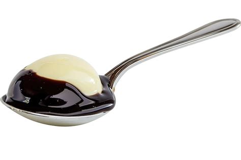 Pudding On Spoon Isolated Premium Ai Generated Image