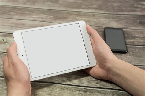 Premium Photo Male Hands Using And Showing The Silver Tablet Horizontally