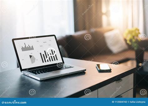 Close Up Of Laptop With Graphs Charts Diagrams Schedule On Screen On