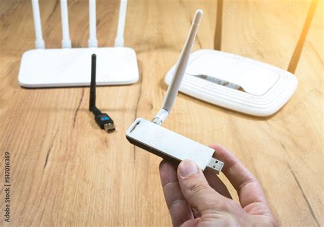 Zdjęcie Stock Man choose of different types of Wi Fi routers modern and old technology