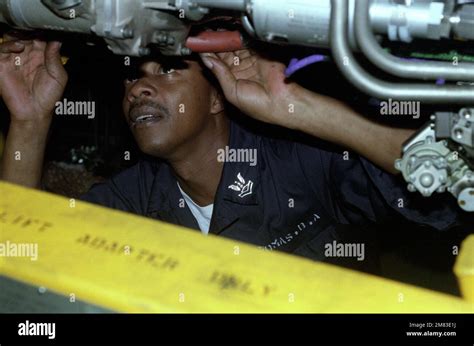 Aviation Machinist Mate Second Classs Thomas Removes A Fuel Flow