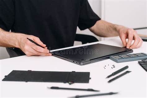 Man Replace Old Battery On Pc Computer Or Digital Tablet Stock Image