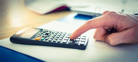 Premium Photo Businessman Hands Typing On Calculator