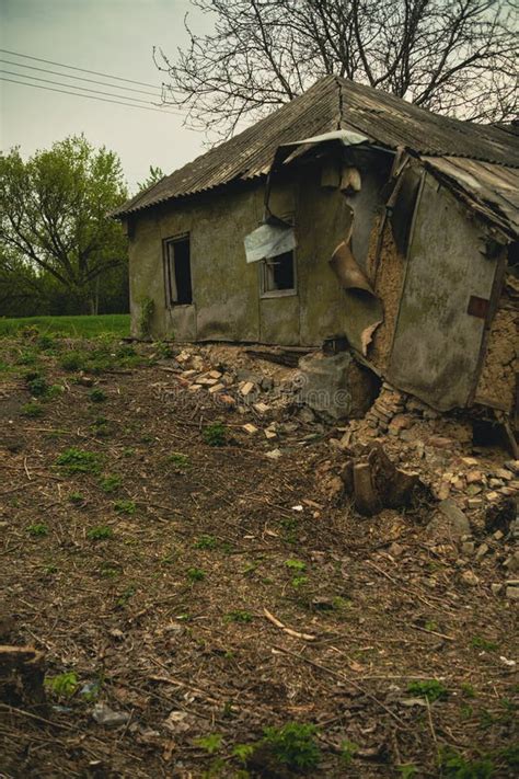 Dilapidated Rural Cottage On A Cloudy Day With Overgrown Vegetation Abandoned House Falling