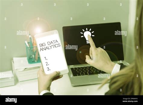 hand writing sign big data analyticsthe process of examining large and