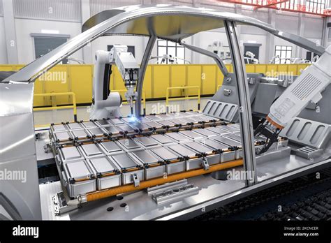 Automation Automobile Factory Concept With 3d Rendering Robot Assembly Line With Electric Car