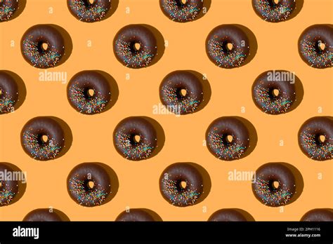 Chocolate Donuts Pattern Isolated On Orange Background Bakery Doughnut Treat Sweet Food Top