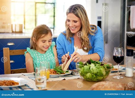 Looks Like this is Made with Lots of Love, Mom. a Mother Serving Food To Her Little Daughter at ...