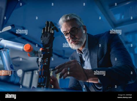 Robotics Engineer Adjusting Calibring Robotic Prosthetic Hand Concept Of Modern Technology In
