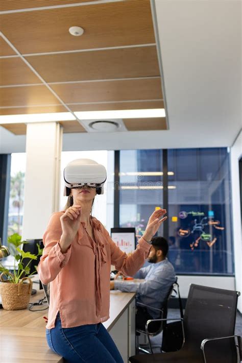 Using Vr Headset Woman Exploring Virtual Reality In Modern Office Environment Copy Space Stock