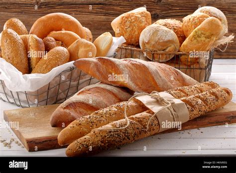 Different Types Of Breads On Wooden Background With Empty Space For Text Stock Photo Alamy