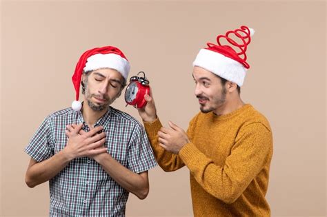 Free Photo Front View Two Men One Putting Hands On His Chest And The Other Holding An Alarm