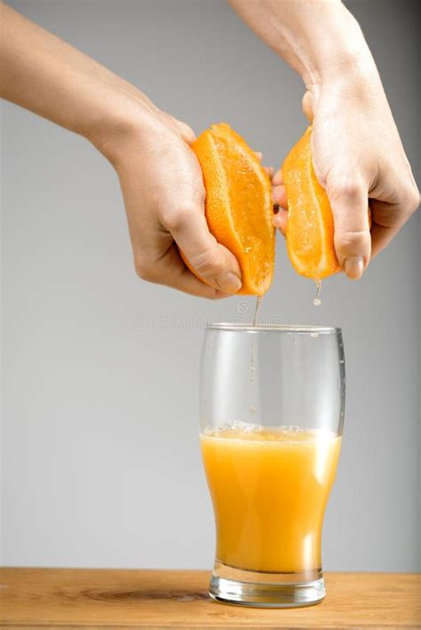 Girl S Hands Squeezing Out Juice from Orange into Glass. Stock Photo - Image of healthy ...