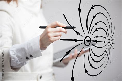 Babe Woman Physics Teacher Draws A Diagram Of The Electric Field Stock Photo Adobe Stock
