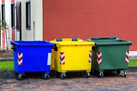Premium Photo Garbage Bin Against Building