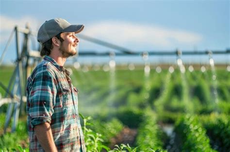 Premium Photo A Farmer Monitoring A Digital Irrigation System