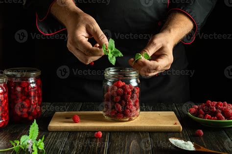 Adding Aromatic Fresh Mint To Raspberry Drink By Hands Concept Of