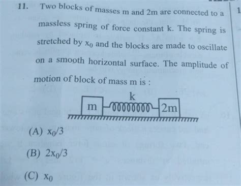 11 Two Blocks Of Masses M And 2 M Are Connected To A Massless Spring Of