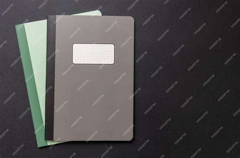 Premium Photo School Notebooks Stack Old Fashioned On Black Color Background Blank Label Copy