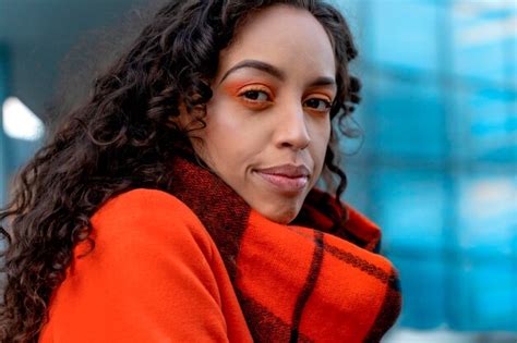Premium Photo Portrait Of African Mixed Race Woman In Orange Coat And