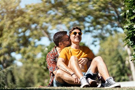Happy Gay Couple Having Fun In Park By Stocksy Contributor Santi
