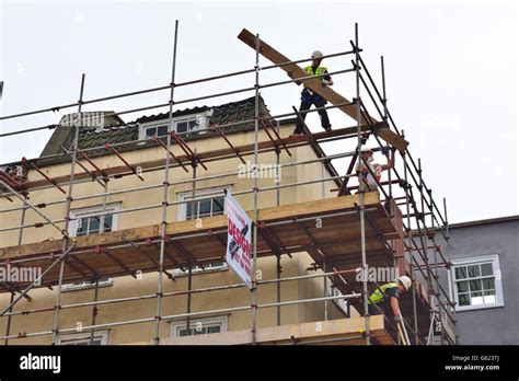 Workmen Erecting Scaffolding Stock Photo Alamy