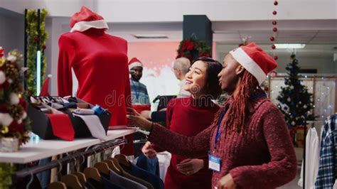 Retail Assistant Shows Client Garments Stock Footage Video Of