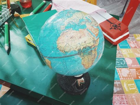 Premium Photo High Angle View Of Globe On Table