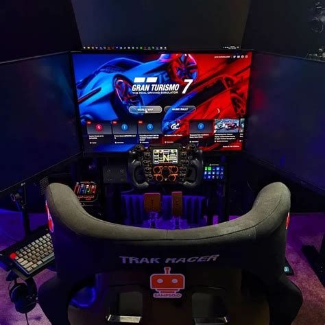 Racing Simulator Setup With Two Monitors And Keyboards