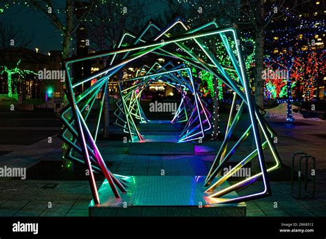 A Dazzling Neon Display Of Rotating Squares Illuminates The Night Sky