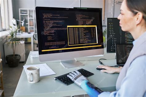 Premium Photo Software Developer With Prosthetic Arm Checking