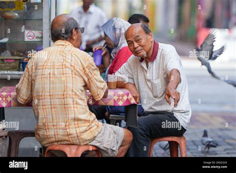 Some Local People Having Breakfast At A Stall At The Seremban Street