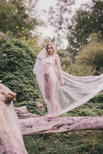 Premium Photo Woman Standing On Field Against Trees