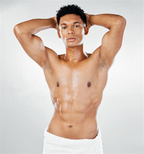 Topless Abs Model Studio Portrait With Perfect Muscle And Physical Body Wellness Against Grey