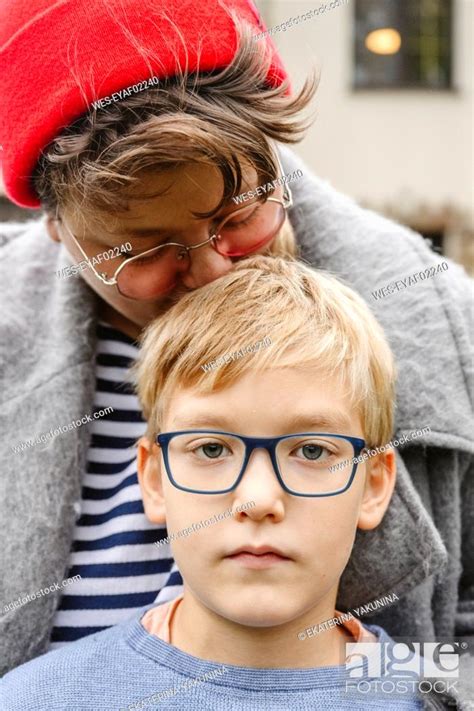 Mother Wearing Eyeglasses Embracing Son Stock Photo Picture And