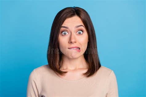 Photo Of Pretty Worried Person Biting Lips Stare Speechless Isolated On