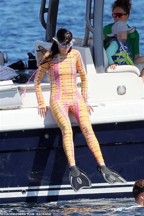 Anne Hathaway Protects Her Youthful Skin In A Colourful Tie Dyed All In