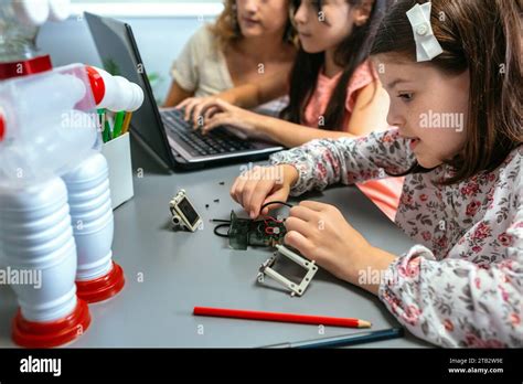Female Babe Connecting Wire On Electrical Circuit In Robotics Class Stock Photo Alamy