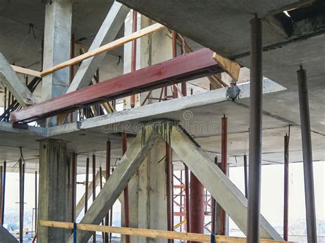 Inside A Building Under Construction Displaying The Concrete Beams And Support Systems Stock