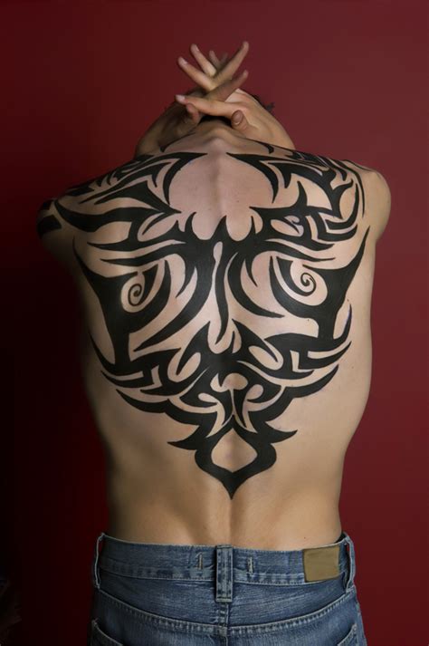 30 Amazing Tribal Tattoo Designs For Men